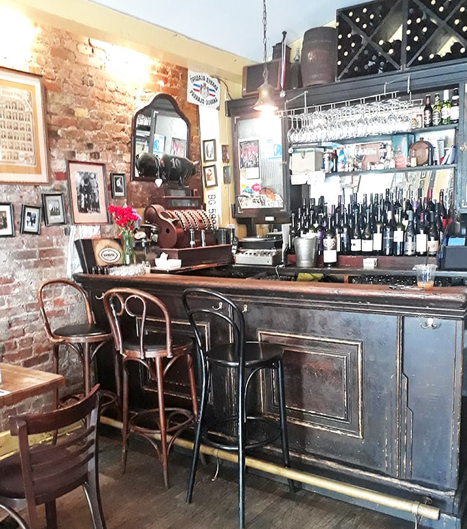 The bar area balances rustic charm with urban cool, where Serbian wines and rakija await your discovery.