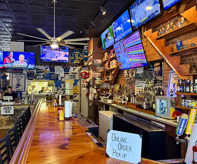 The bar area doesn't just serve drinks—it serves community, with memorabilia-lined walls telling stories while bartenders craft liquid companions for legendary sandwiches.