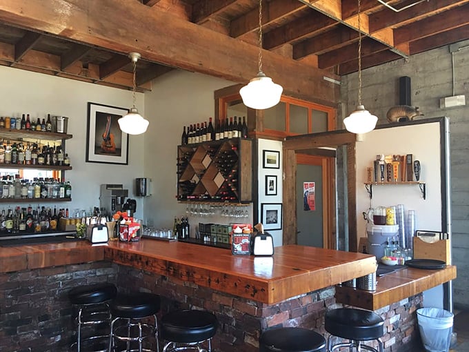 The bar at Podnah's – where bourbon and beer stand ready to complement your barbecue journey through the smoke-kissed promised land.