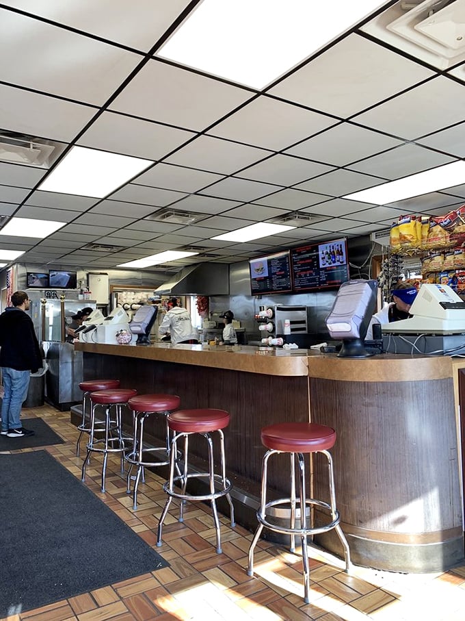 The counter stools—each one a front-row seat to culinary theater where loose meat sandwiches are the starring attraction.