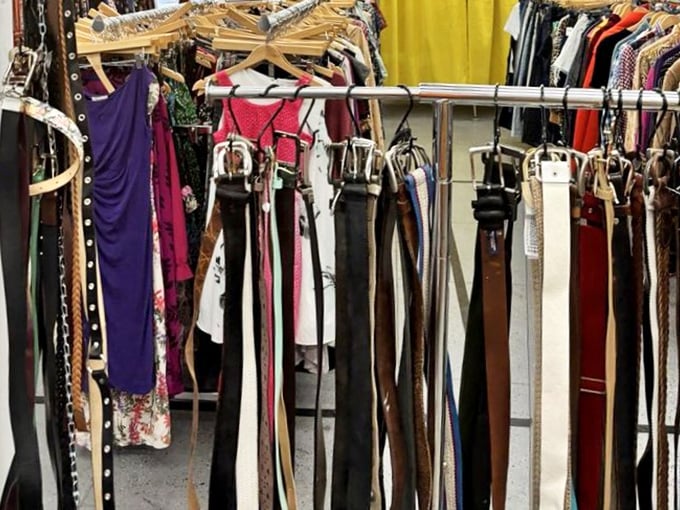 The accessories wall—where belts of past decades hang like timeline markers of fashion history. That studded one? Pure 80s rock nostalgia.