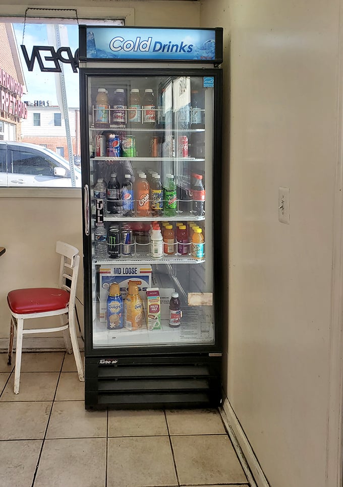 The beverage cooler stands ready with liquid companions for your donut adventure—because even sweet perfection needs a sidekick.