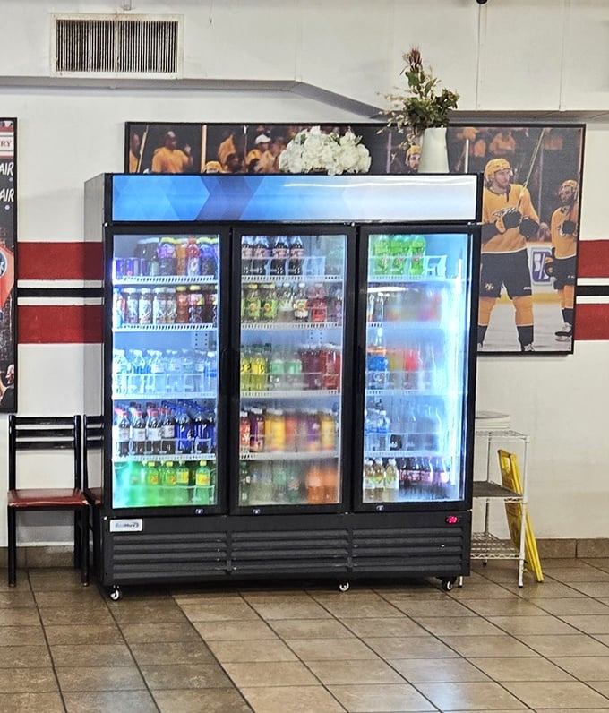The beverage cooler stocked with colorful drinks – because washing down soul food with anything less than sweet tea feels like a missed opportunity.