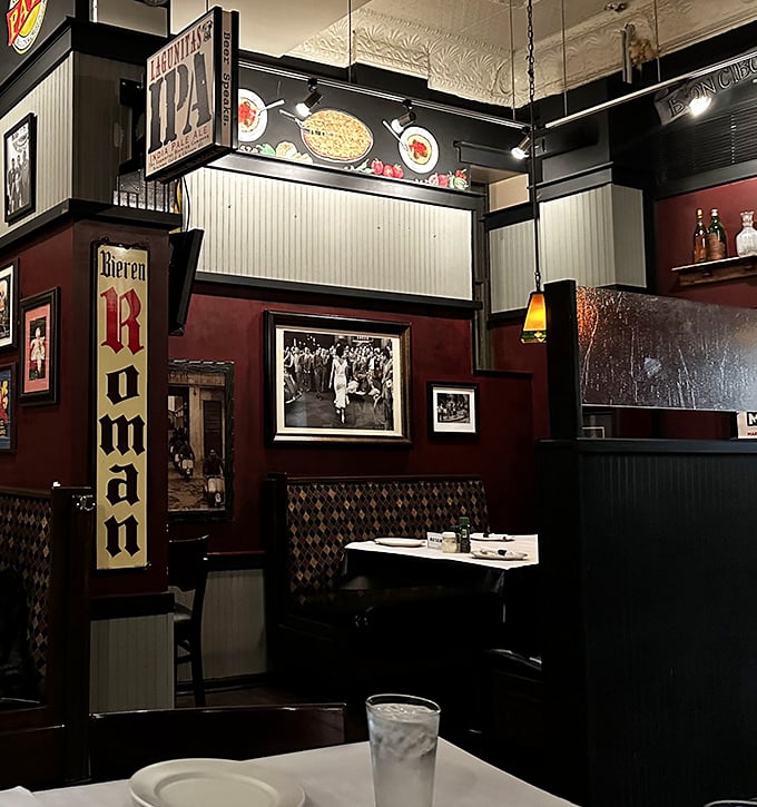 The corner booth with its vintage signage offers that perfect blend of privacy and people-watching that makes neighborhood restaurants feel like home.