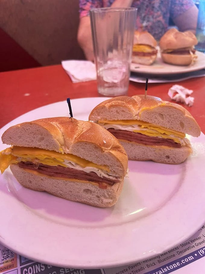 Behold the humble yet mighty breakfast sandwich—where eggs, meat and cheese achieve perfect harmony on a throne of toasted bagel.