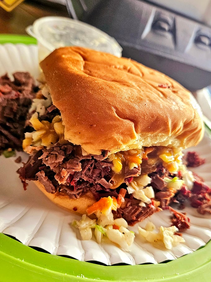 This sandwich doesn't just contain brisket – it showcases it, with coleslaw and corn playing supporting roles in this handheld masterpiece.