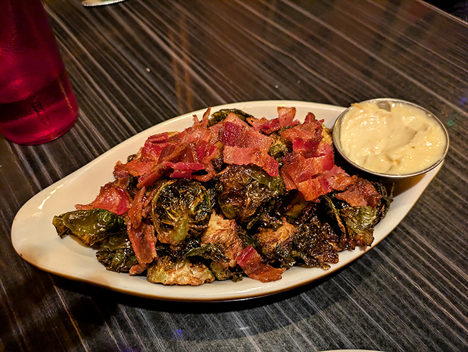 Brussels sprouts that even your childhood self would devour—roasted until caramelized, then showered with bacon confetti because... Portland.