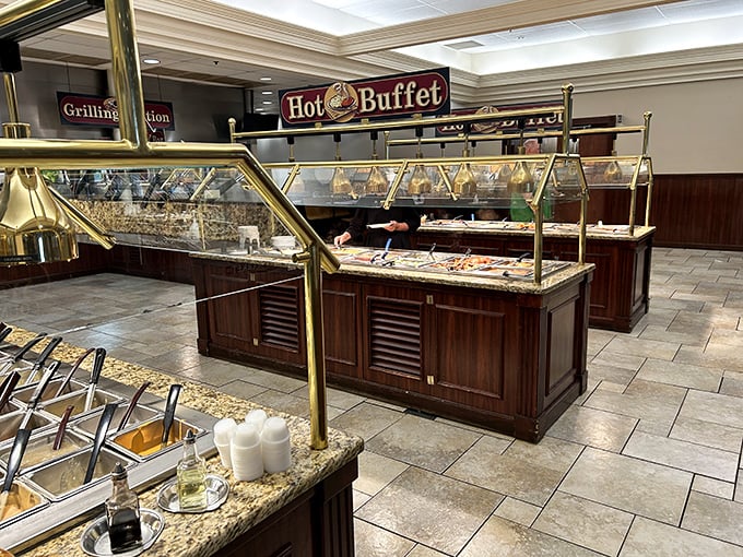 The hot buffet area gleams with brass and promise—a gastronomic runway where comfort foods strut their stuff under perfect lighting.