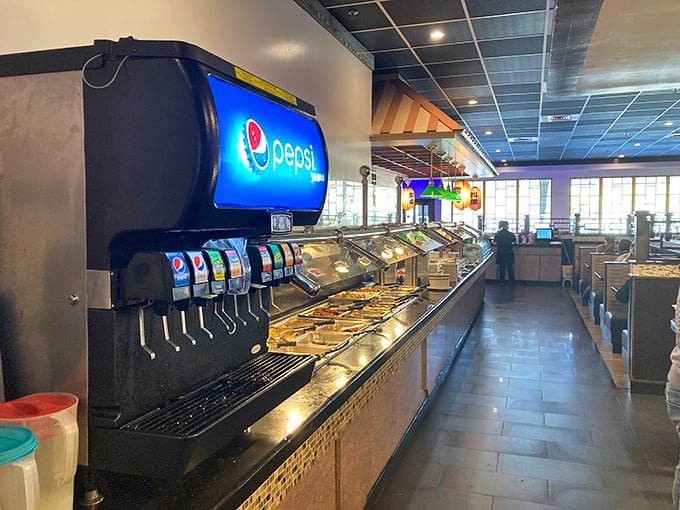 The soda fountain stands sentinel beside the buffet line—because washing down all these flavors requires proper hydration strategy.