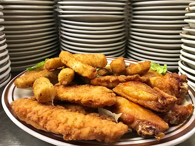 Fried chicken and hush puppies arranged with the kind of care usually reserved for diamond displays at Tiffany's. Crispy, golden, and worth every napkin.