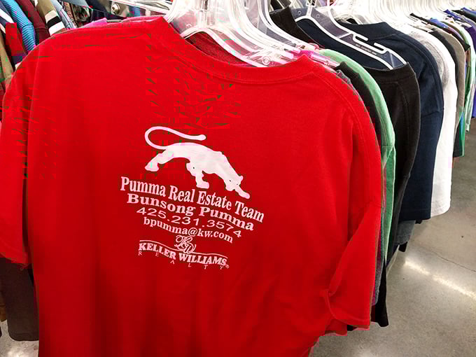 The corporate-branded t-shirt section: where local businesses achieve immortality and you can join teams you never applied for.