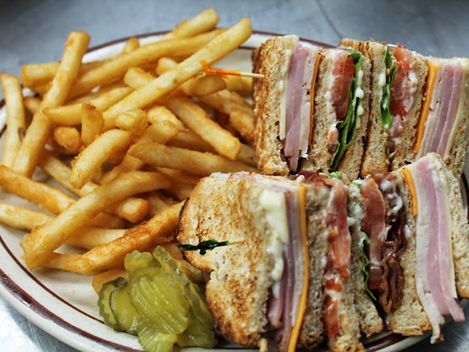 The club sandwich – mankind's greatest achievement in strategic layering since the invention of winter clothing. Those fries look criminally good.