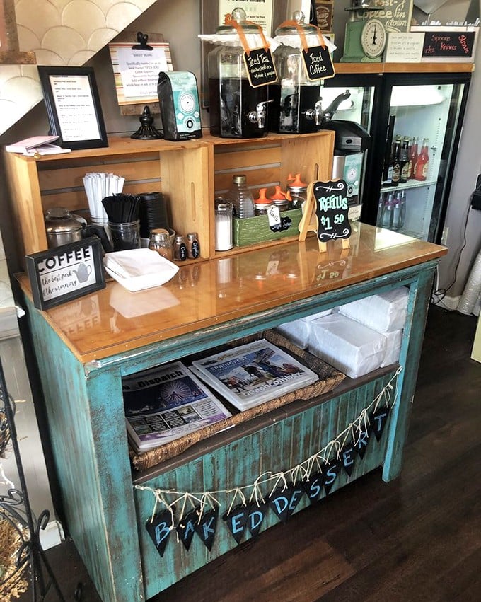 The coffee station—because every great pastry deserves a worthy companion. That weathered turquoise cabinet has stories to tell.
