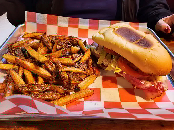 A sandwich and fries served on checkered paper – the universal signal that you're about to experience something authentically delicious without pretension.