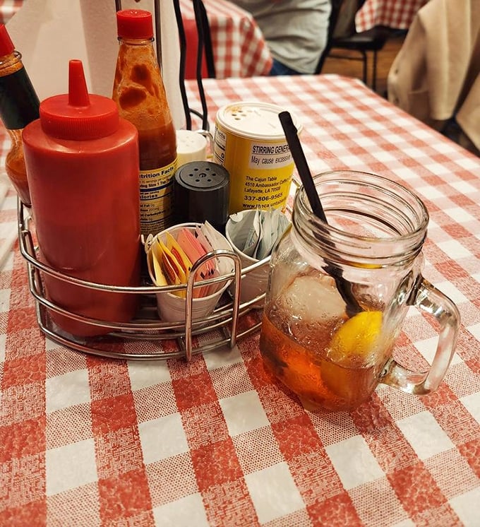 The condiment caddy—that unsung hero of personalization where hot sauce, ketchup, and sweetener packets await their supporting roles in your meal.
