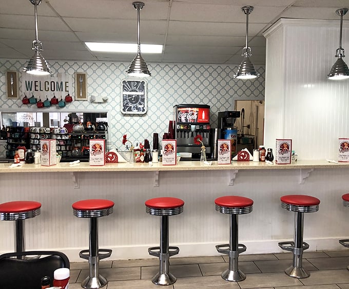 The counter seating—where solo diners become regulars and the coffee refills come with a side of local wisdom and friendly banter.