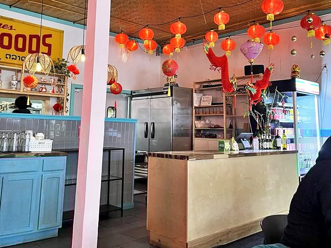 The counter area adorned with festive lanterns, where orders are placed and delicious anticipation officially begins for hungry customers.