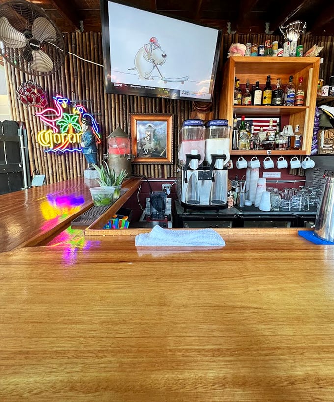 The bar area isn't just serving drinks—it's dispensing liquid happiness to complement the smoky treasures on your plate.
