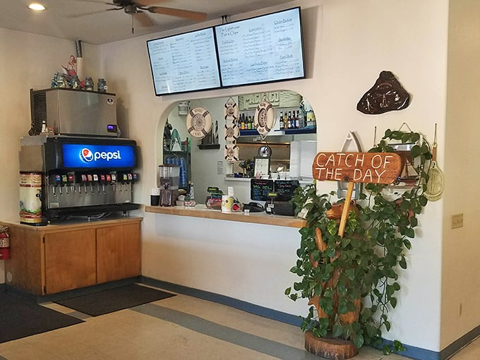 The "Catch of the Day" sign and ordering counter—where seafood dreams begin. Simple, straightforward, and utterly unpretentious.