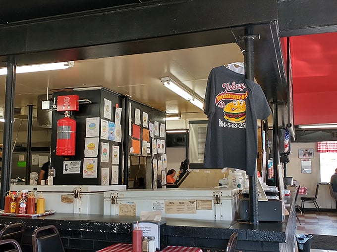 The beating heart of the operation—where orders are called, tickets are hung, and burger magic happens behind the counter.