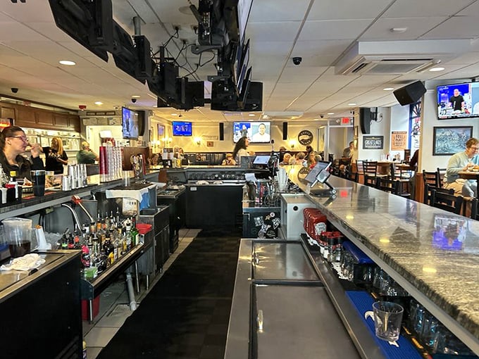 The bar area offers a front-row seat to the liquid artistry happening behind the counter – where history-themed drinks meet modern thirst.