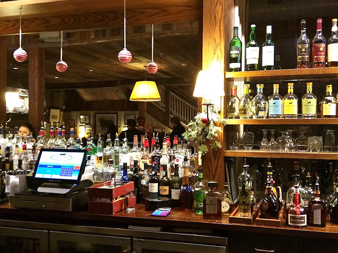 The well-stocked bar promises craft cocktails and fine wines to complement your meal—liquid happiness awaiting in bottles of every shape and size.