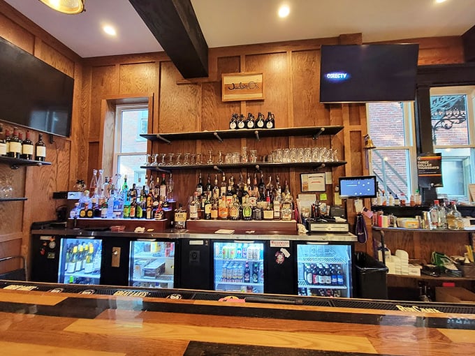 Behind this bar is where the magic happens—wood, bottles, and the promise of perfectly poured pints.