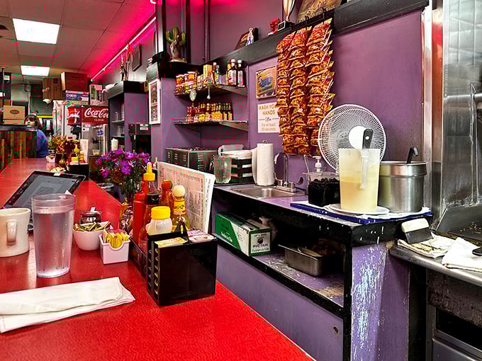 Behind every great diner is a counter that's seen it all. The chips hanging like flavor trophies are just part of the charm.
