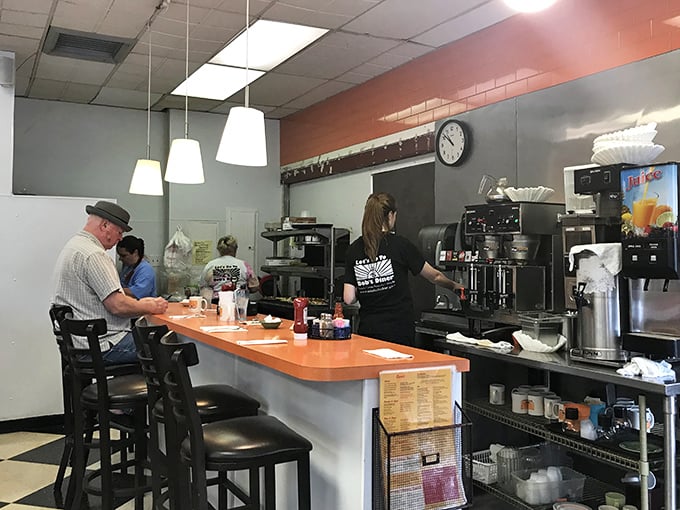The counter—where solo diners find community, coffee cups are never empty, and the staff performs the daily ballet of breakfast service.