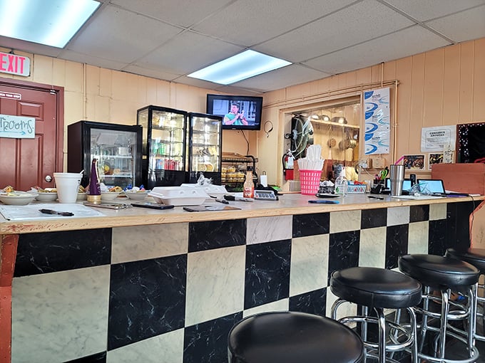 The counter where magic happens. No molecular gastronomy, no foam, no pretense – just decades of culinary wisdom and skill.