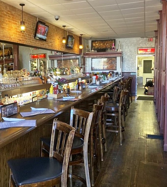 The long, inviting bar is where strangers become friends and friends become family—all bonded by exceptional food and drink.