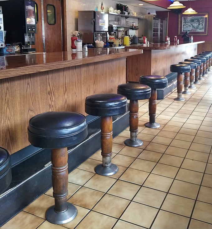 Counter seating: where solo diners become regulars and the coffee refills arrive before you even ask.