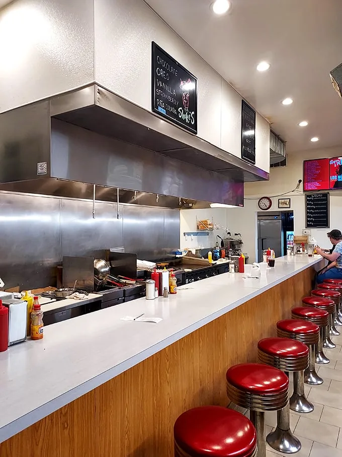 Red stools at the counter offer front-row seats to the sizzle and flip show—Chicago's most satisfying spectator sport.