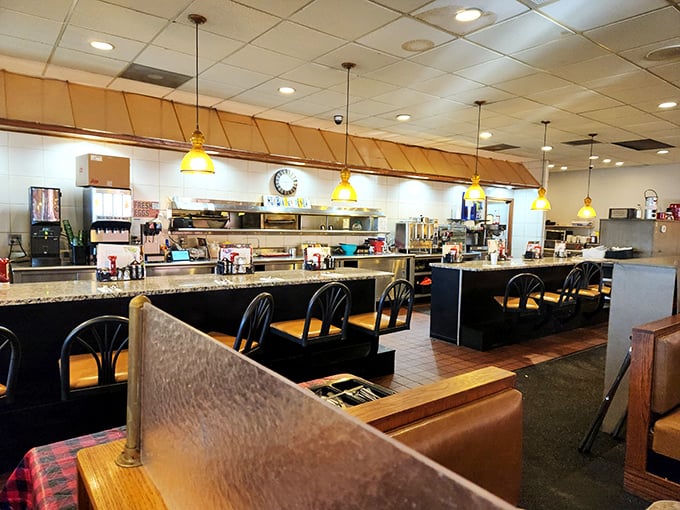 Counter seating—where solo diners find community and the kitchen's symphony plays its most intimate performance.