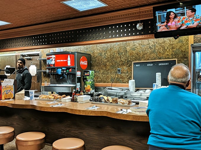 The counter – where solo diners never feel alone and the staff performs their daily ballet of plates and orders.