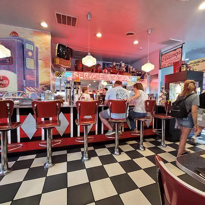 The counter seats—where solo diners find community and regulars earn their nickname. That "Service Station" sign isn't just decor; it's truth in advertising.