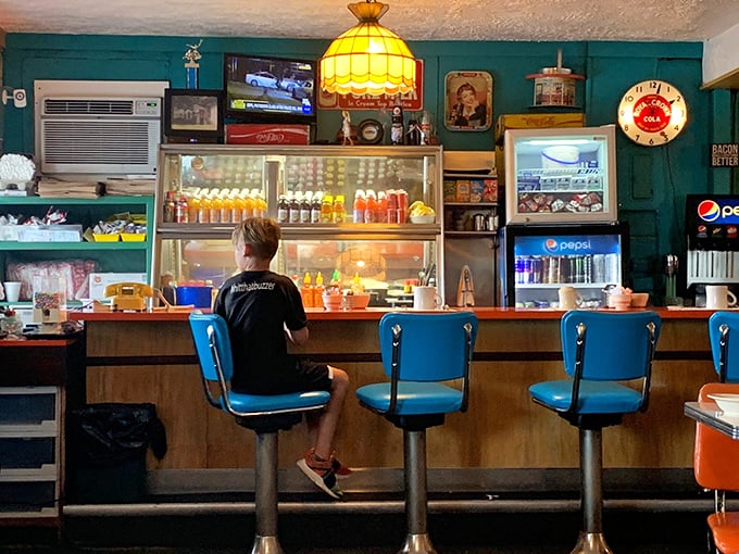 Behind the counter, the heart of Fred's beats with vintage charm—stained glass pendant lights and blue swivel seats that have witnessed countless Ohio mornings.