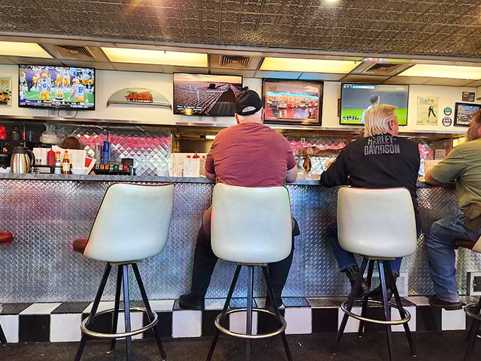 The counter – where solo diners find community and regulars exchange the day's news. These stools have heard more local stories than any newspaper.