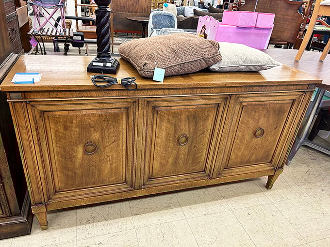 This stately credenza doesn't just store your stuff—it announces to visitors that you have impeccable taste and bargain-hunting superpowers.