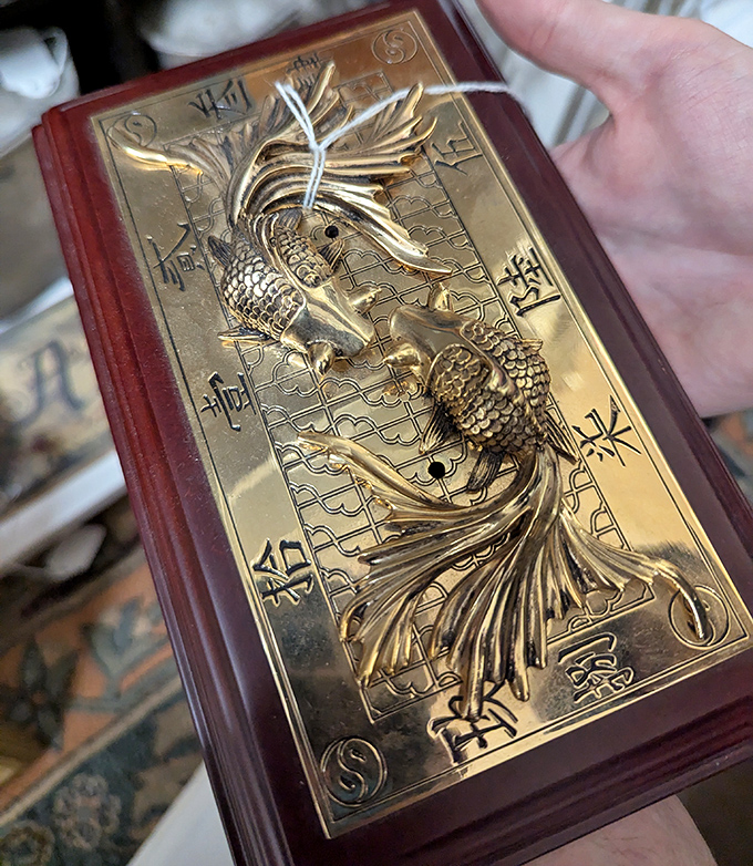 Not just decorative—it's practically wearable architecture. This golden fish plaque transforms ordinary walls into conversation-starting showcases.