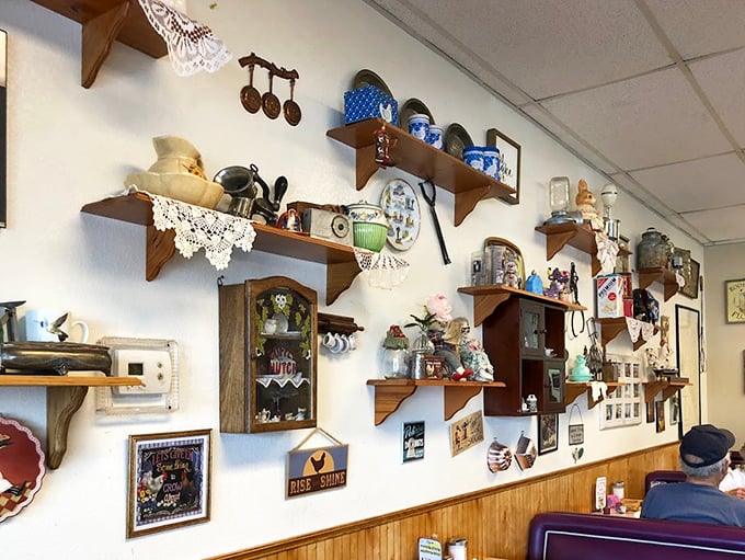 The wall of collectibles tells stories of decades past, each teacup and vintage sign a character in Lou's ongoing narrative.