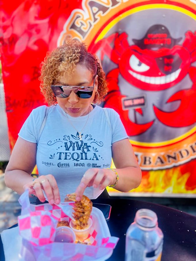 Every great food experience has a human element. This diner knows she's about to embark on a seafood adventure worth documenting.
