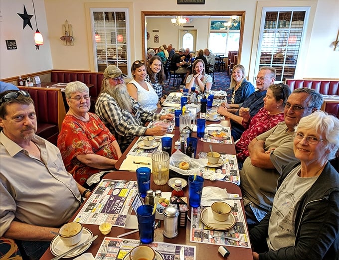 The true heart of any great diner: tables filled with people sharing stories, laughter, and the universal language of "pass the ketchup, please."