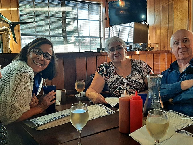 Wine glasses, condiment bottles, and smiles—the essential ingredients for a proper Florida seafood experience among friends.