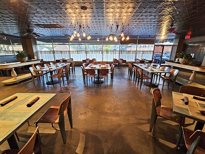 The dining room balances rustic charm with urban sophistication—those pressed tin ceilings reflect both light and good conversation.