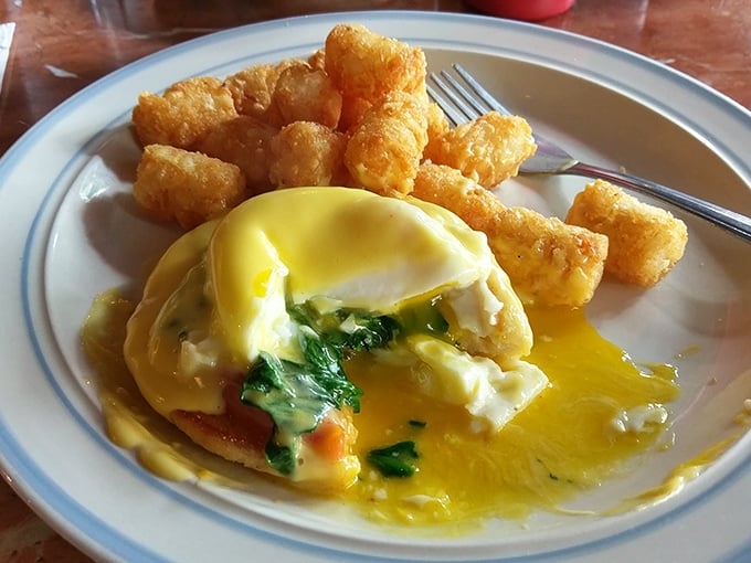 Eggs Benedict that breaks the yolk-tension with dramatic flair. Those tater tots aren't just along for the ride—they're essential supporting characters in this breakfast drama.
