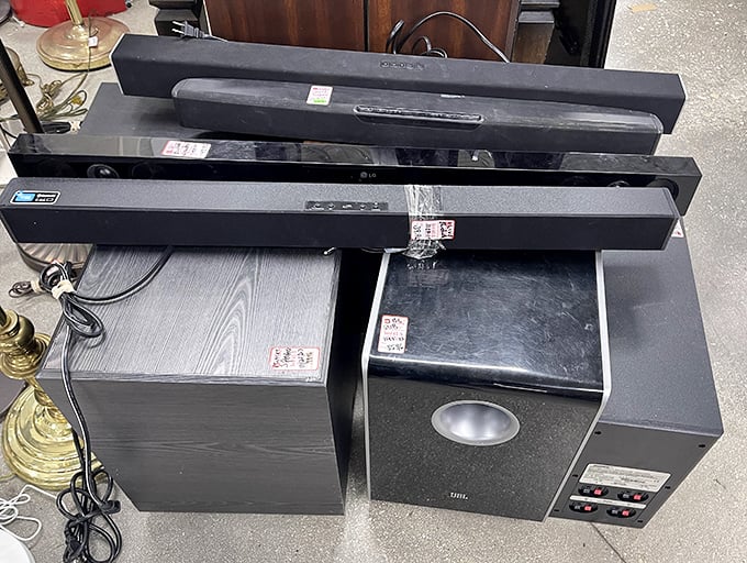 Home theater components stacked like technological layer cake—someone's audio upgrade means your chance to experience surround sound on a shoestring budget.