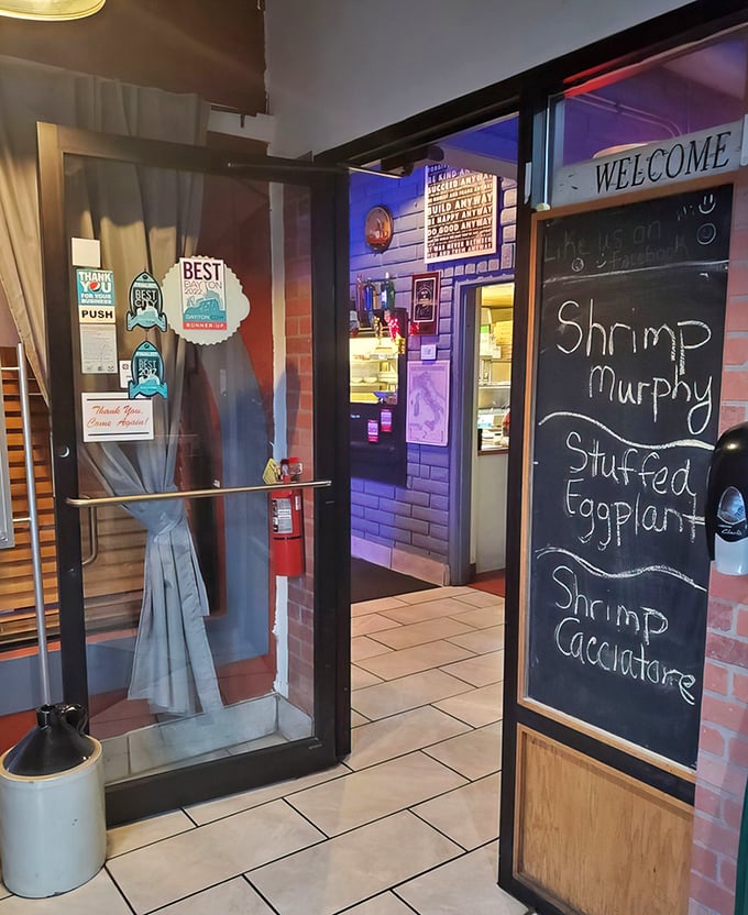 The chalkboard specials – including Shrimp Murphy and Stuffed Eggplant – hint at treasures beyond the regular menu.