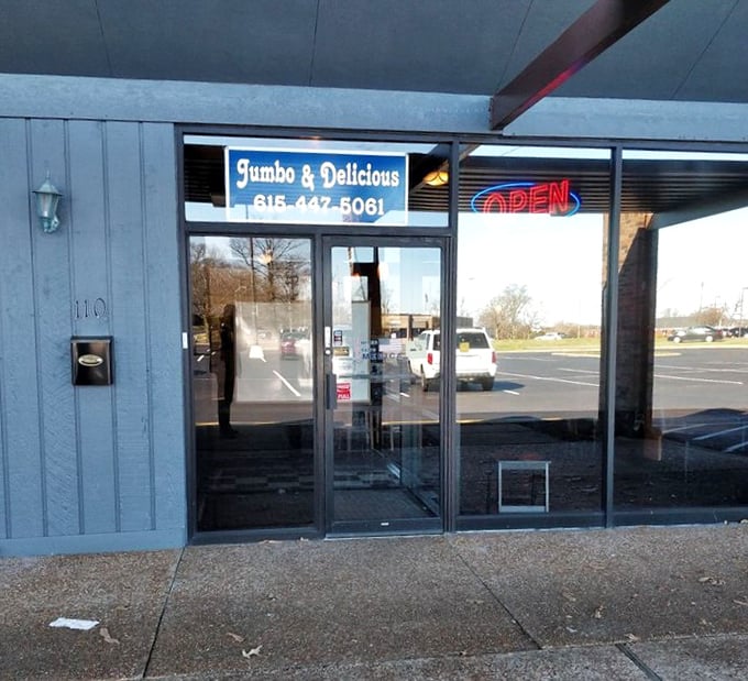 The entrance says it all—simple, straightforward, and promising good things to those who enter. That "OPEN" sign never looked so inviting.