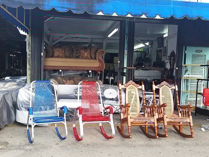Rocking chairs in patriotic hues await new homes. This furniture display brings porch-sitting possibilities to the masses with Americana flair.
